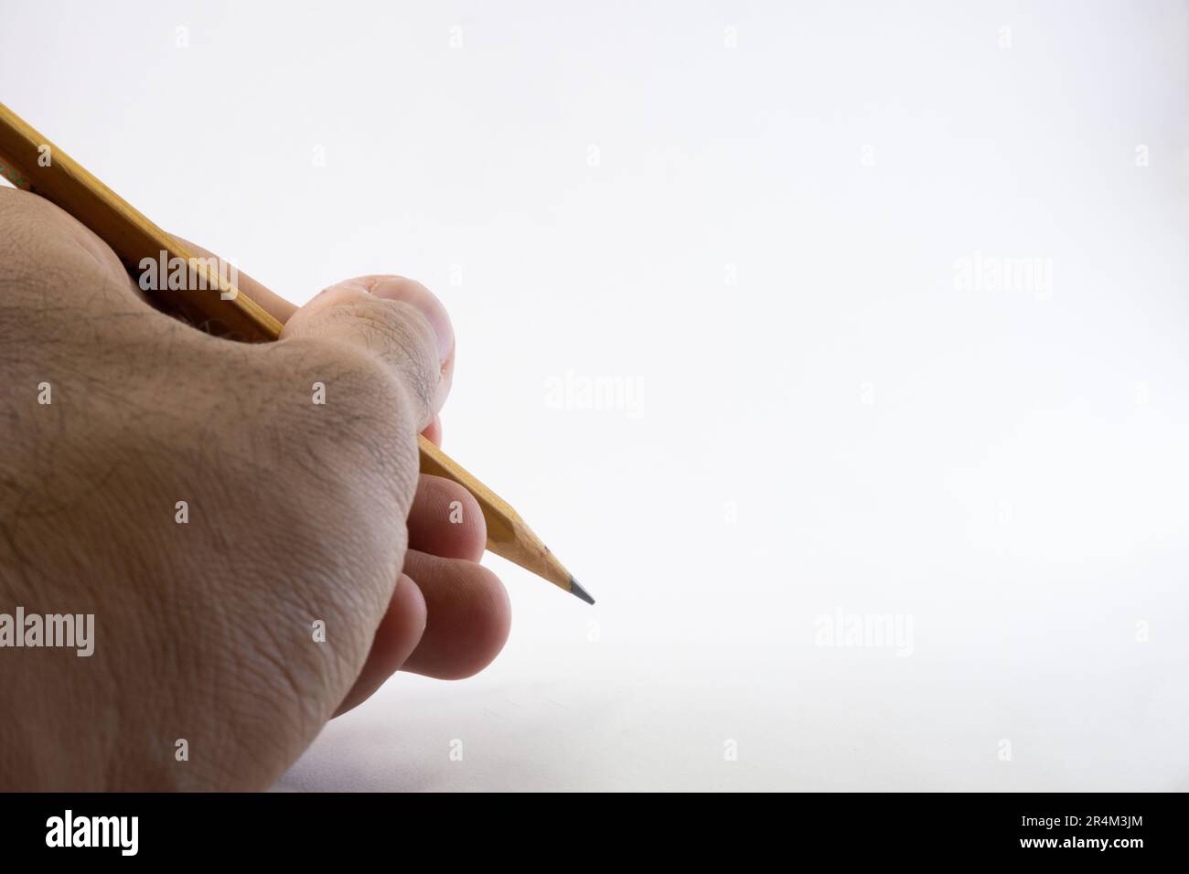 Isolated Hand Holding a Pencil on White Background Stock Photo - Alamy