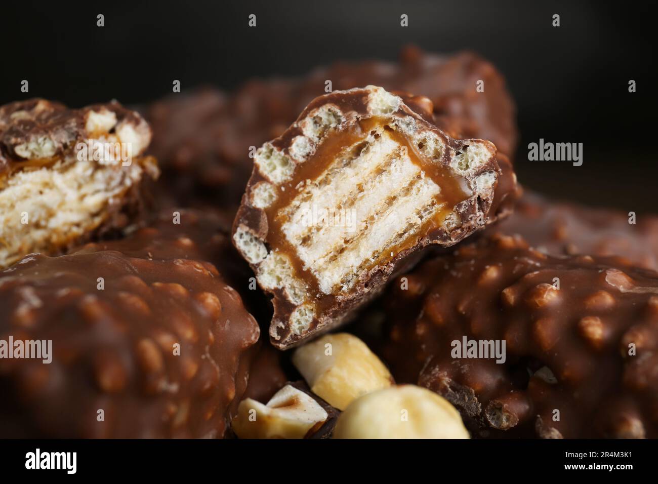 Tasty chocolate bars with caramel and nuts, closeup Stock Photo - Alamy
