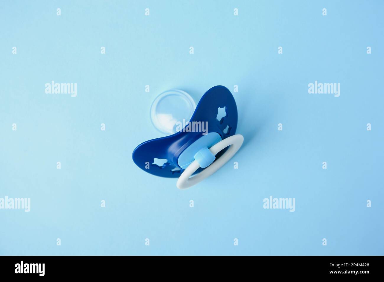 One baby pacifier on light blue background, top view Stock Photo - Alamy