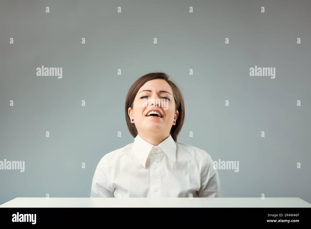 Woman exaggerates and theatrically displays comically intense sadness ...