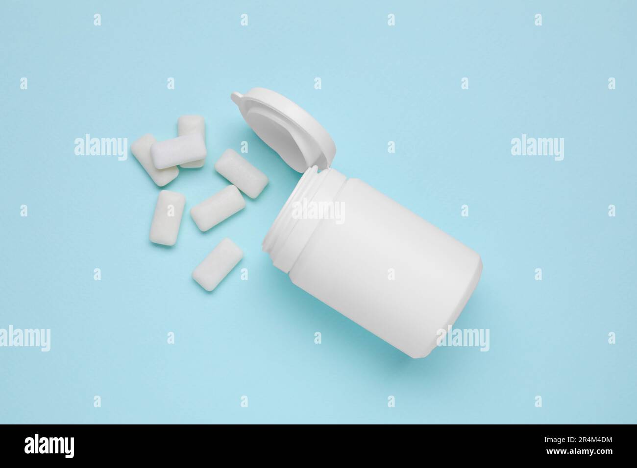 Jar with chewing gums on light blue background, flat lay Stock Photo ...