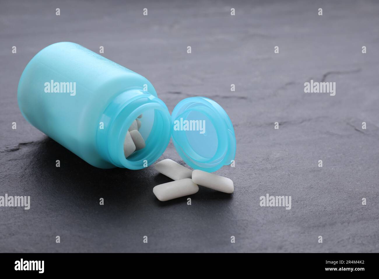 Jar with chewing gums on grey table. Space for text Stock Photo - Alamy