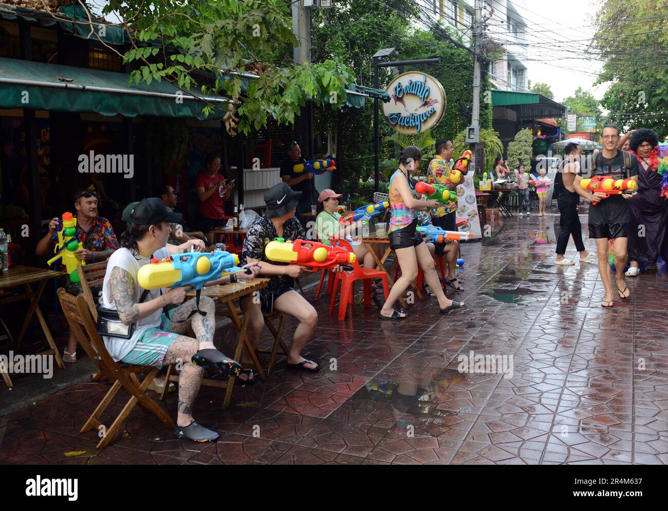 Splashing water during the Songkran festival from the Botanic Backyard bar on Ram Buttri Aly ...