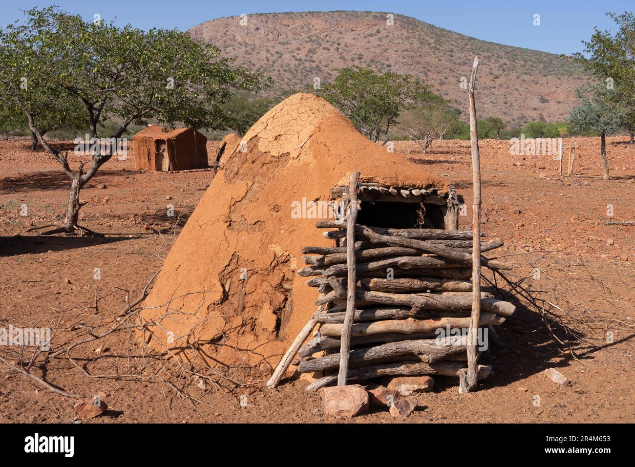 Himba tribe village, Kaokoveld, Namibia, Africa. The crude wooden shed ...