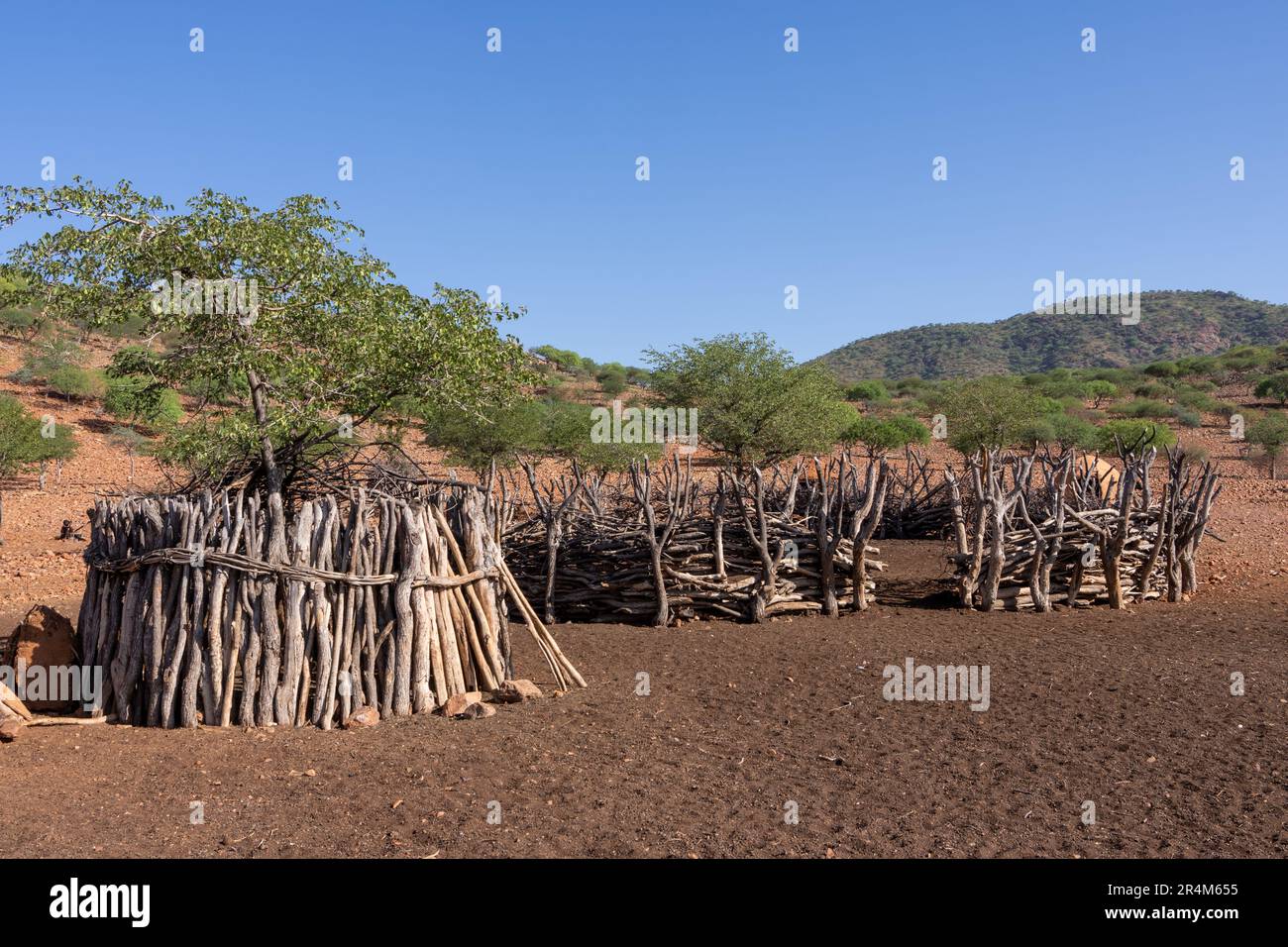 Himba tribe village, Kaokoveld, Namibia, Africa. The crude wooden shed ...