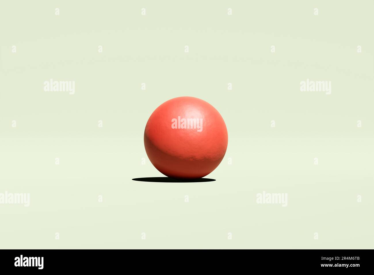 Red colored huge orb or sphere on pastel green background. Minimalistic ...