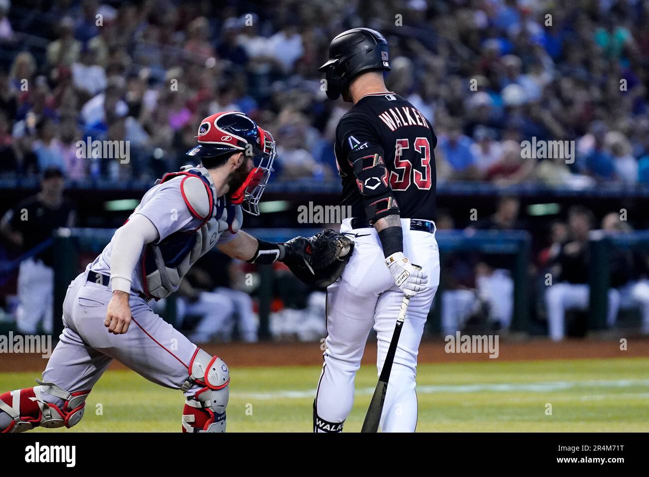 Boston Red Sox catcher Connor Wong, left, tags out Arizona Diamondbacks ...