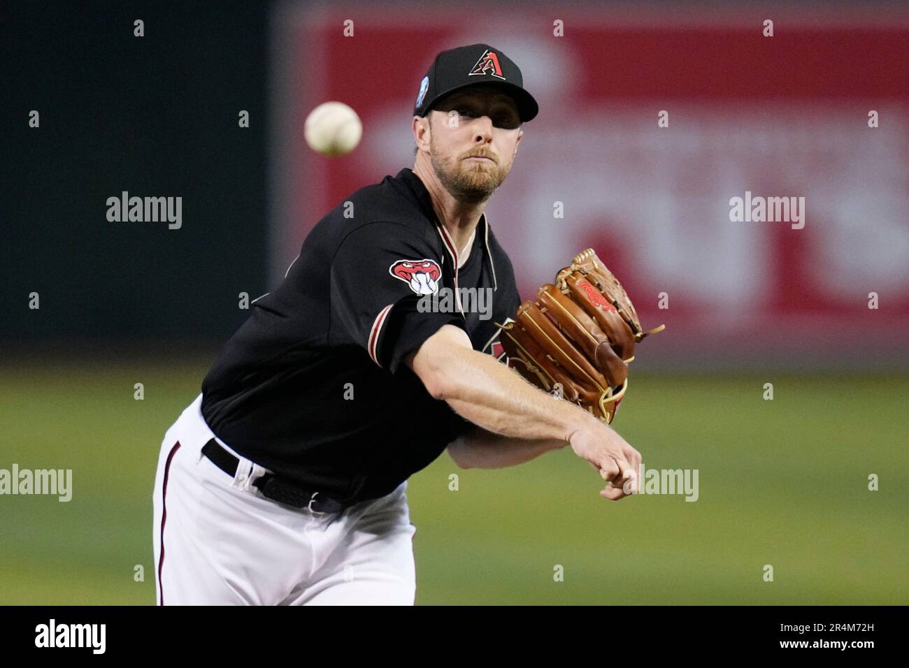 Arizona Diamondbacks starting pitcher Merrill Kelly warms up during the ...