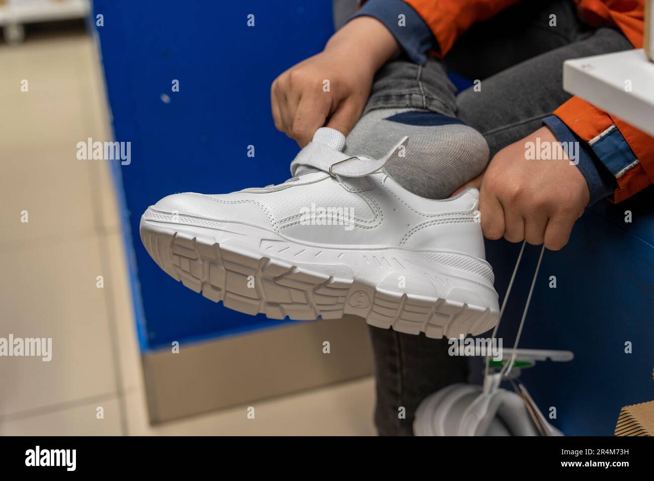 School shoe fitting hi-res stock photography and images - Alamy