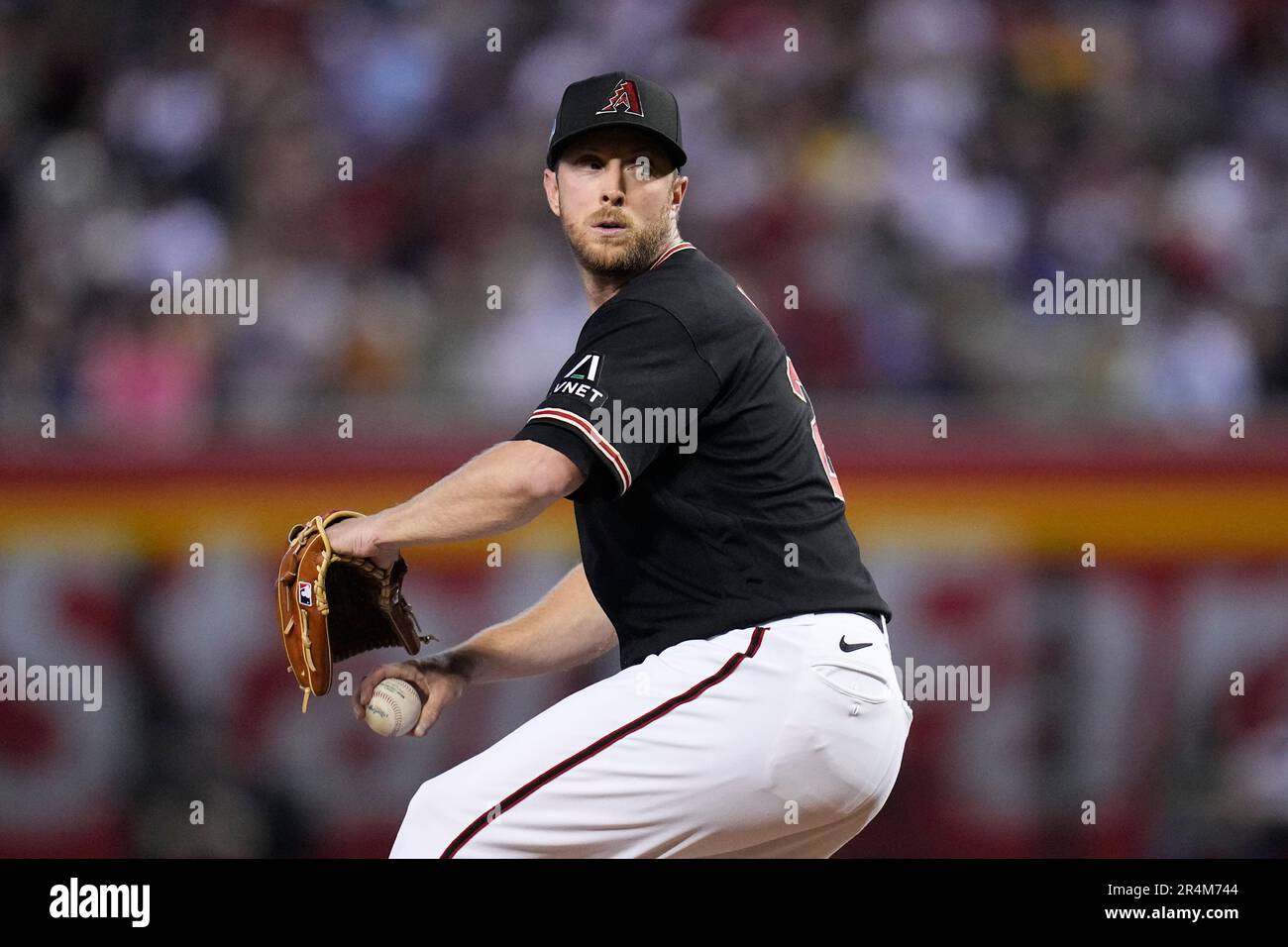 Arizona Diamondbacks starting pitcher Merrill Kelly throws against the ...