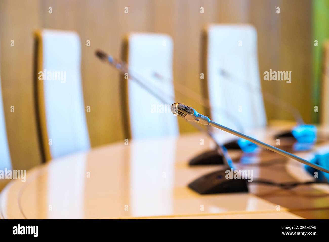 From above of comfortable leather chairs placed near round shaped table ...
