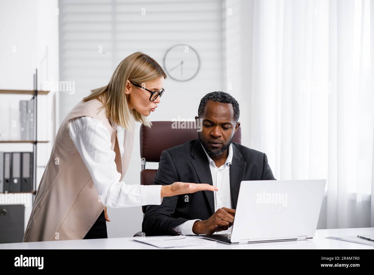 Annoyed business woman scolding male hi-res stock photography and ...
