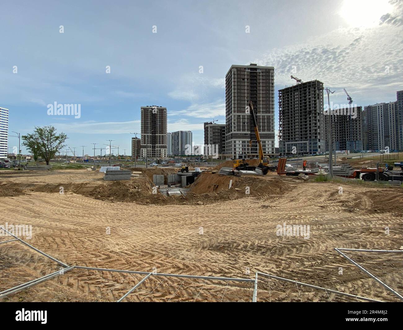 Tall modern beautiful buildings and houses are concrete skyscrapers ...