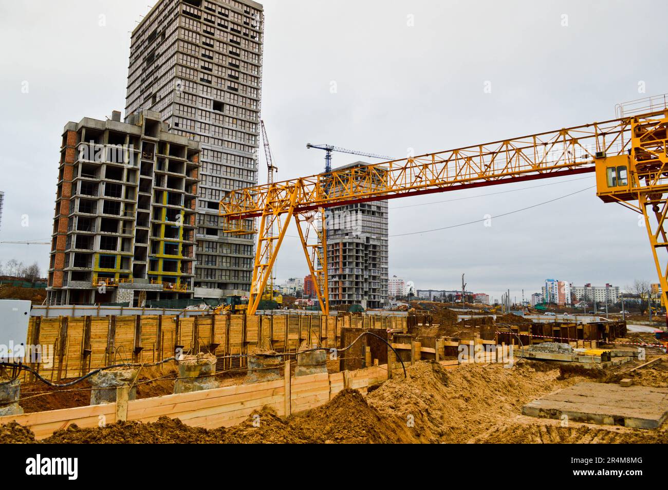 A construction site with specialized professional equipment and cranes ...