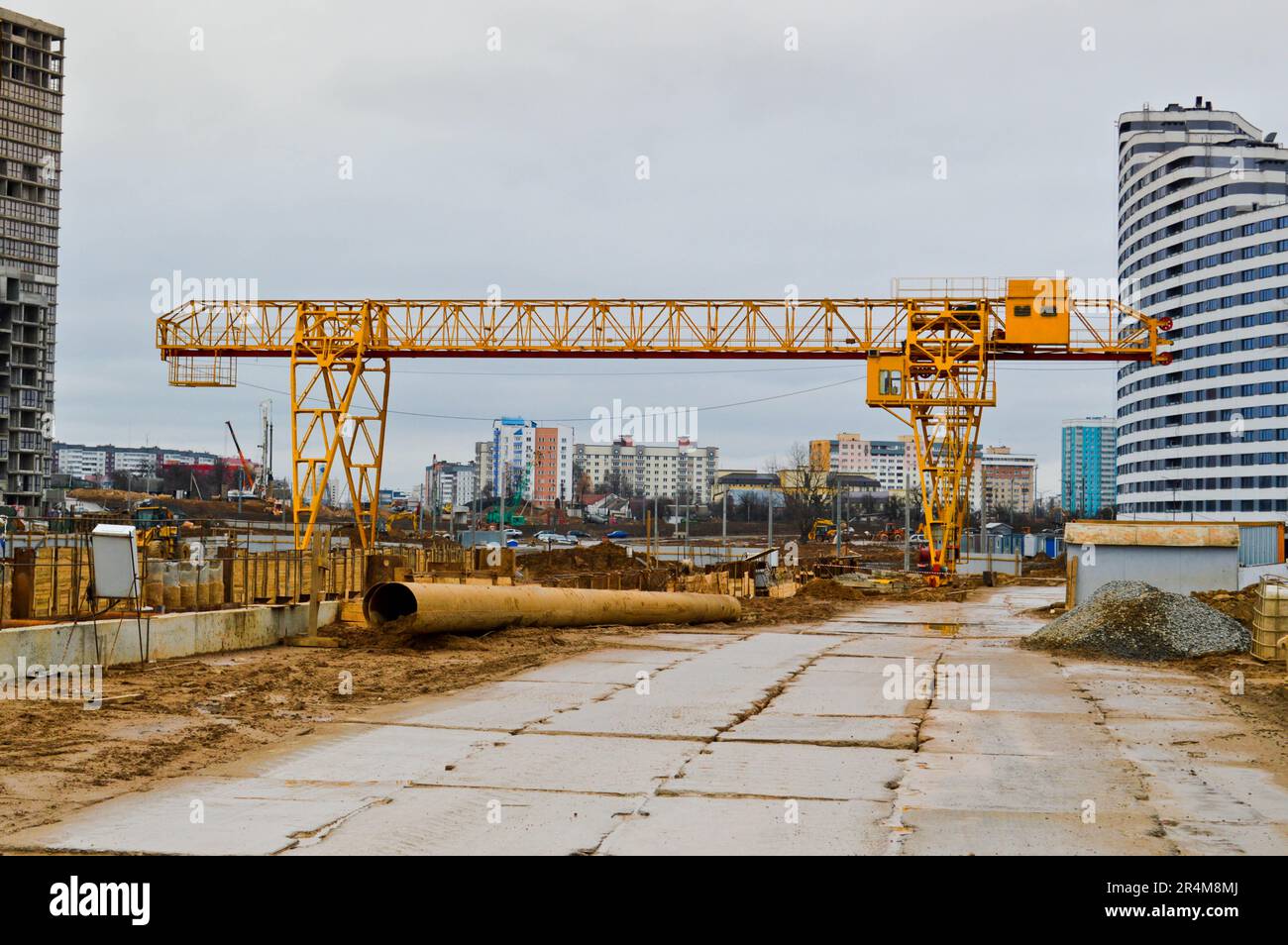 A construction site with specialized professional equipment and cranes ...