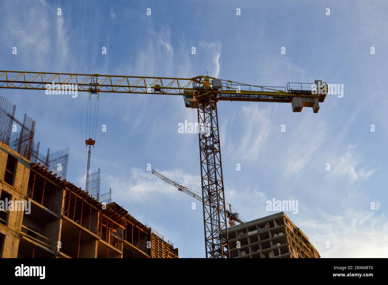 construction of a new residential building from concrete blocks. crane ...