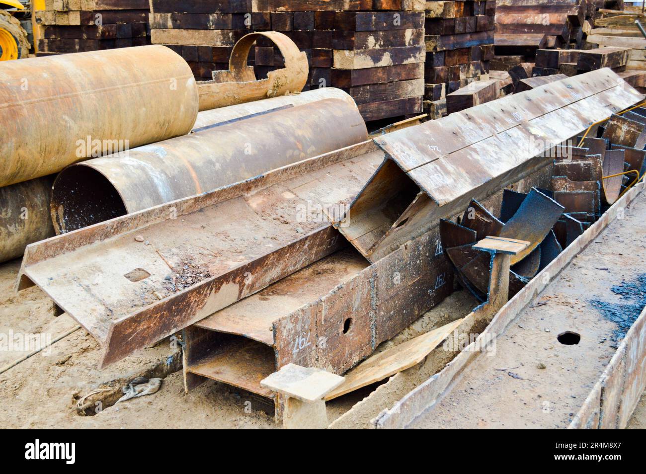 A lot of building materials with metal spare parts, sticks, beams ...