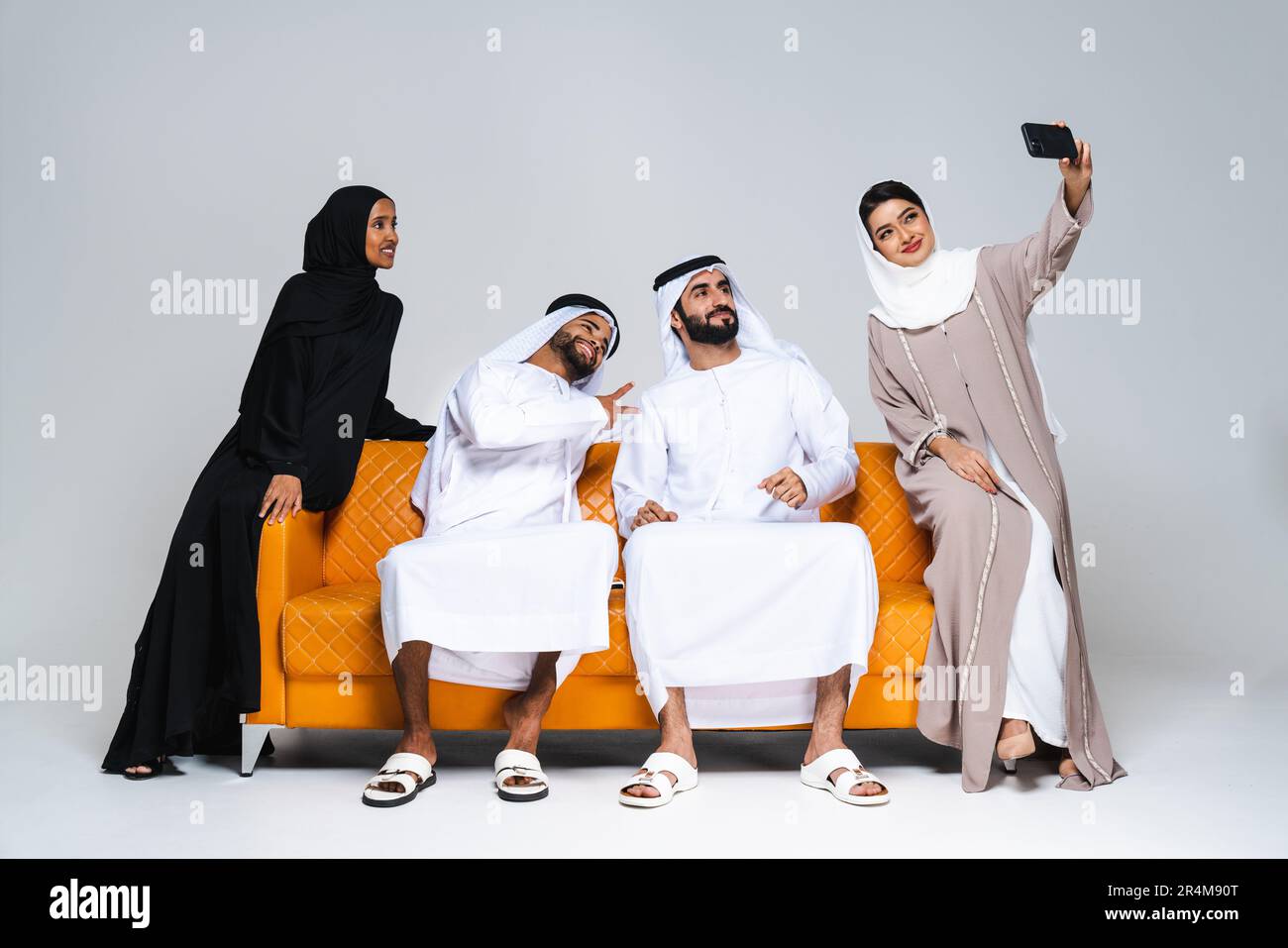 Beautiful arab middle-eastern happy group of friends wearing ...