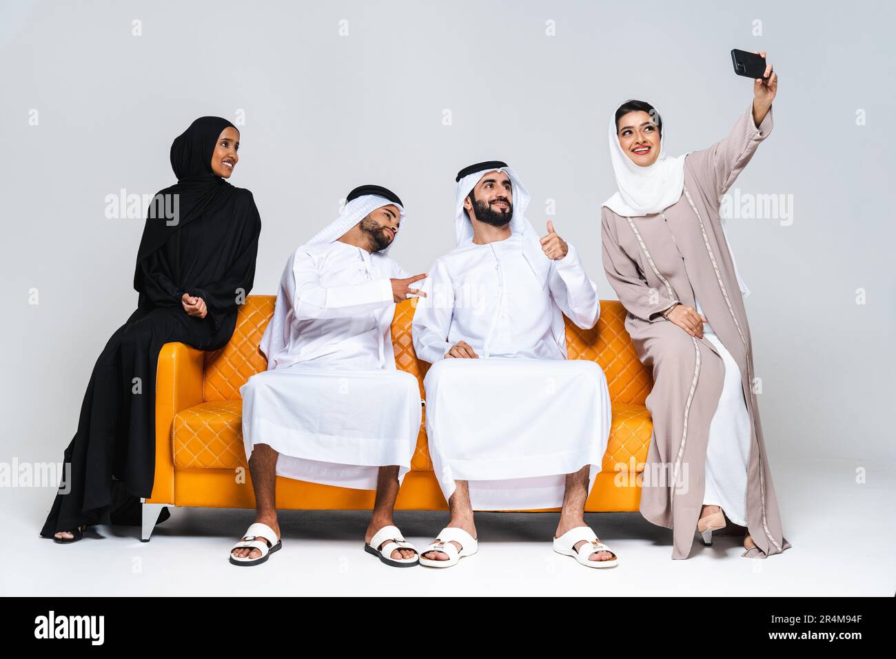 Beautiful arab middle-eastern happy group of friends wearing ...