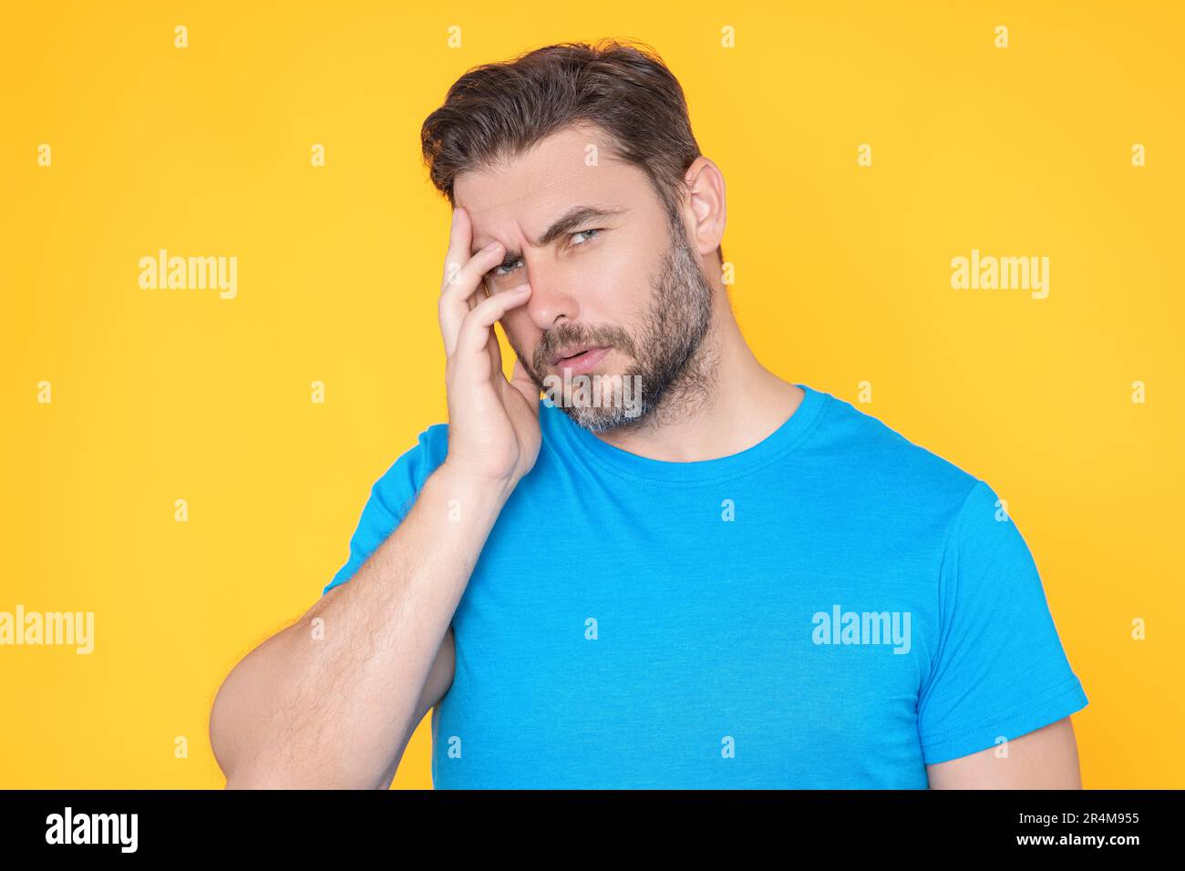 Pensive man isolated on studio background thinking. Thoughtful man ...