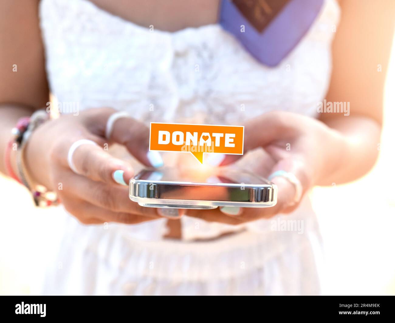 Close-up donate icon in bubble speech symbol appear on smart mobile ...