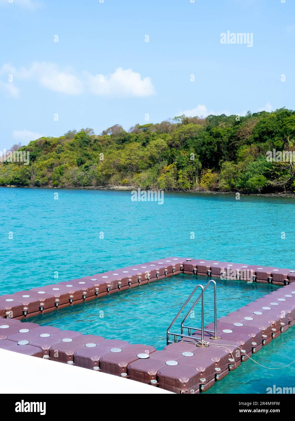 Floating swimming pool made by floating modular plastic blocks with ...