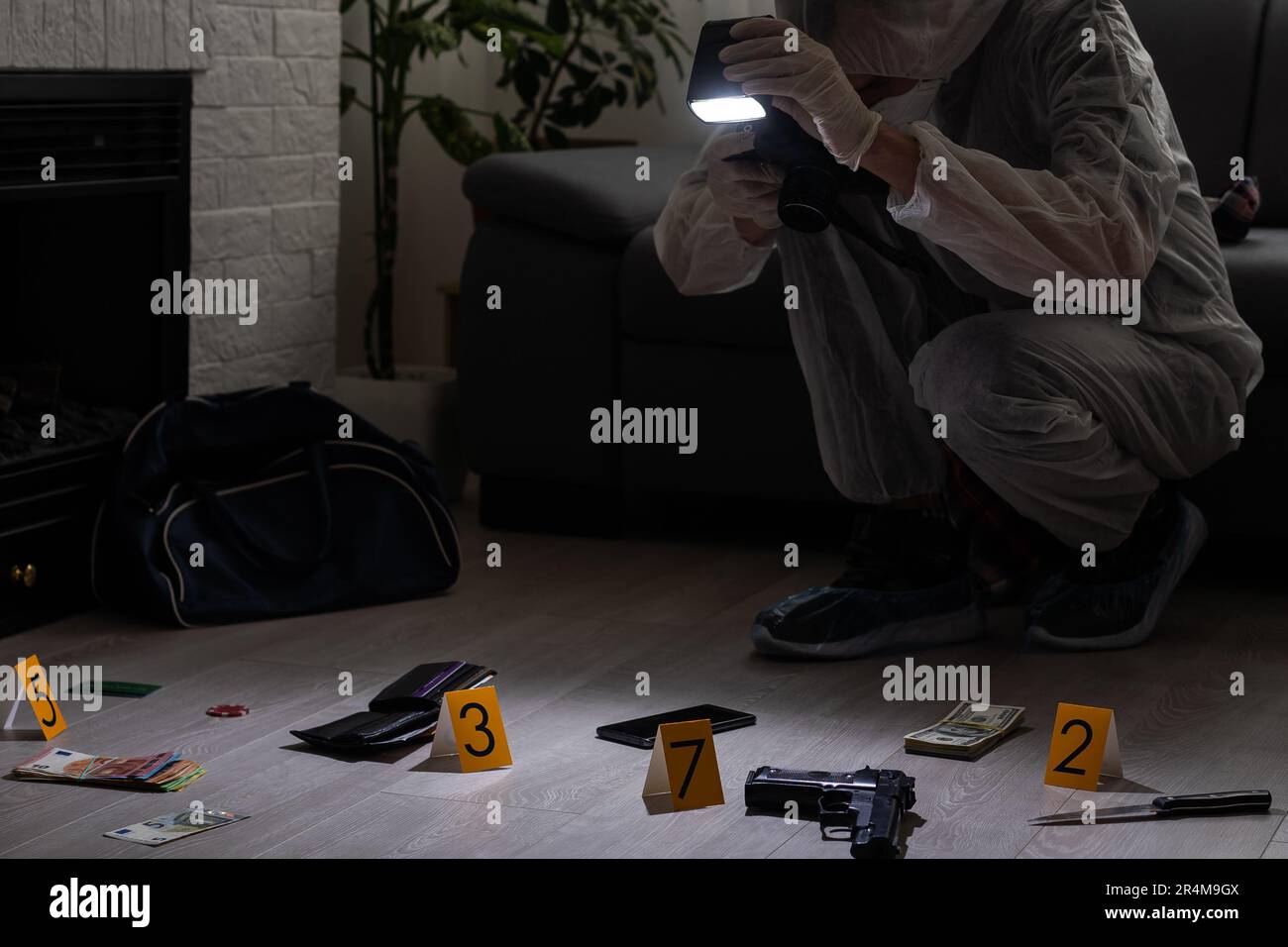 Detective Collecting Evidence In A Crime Scene Forensic Specialists