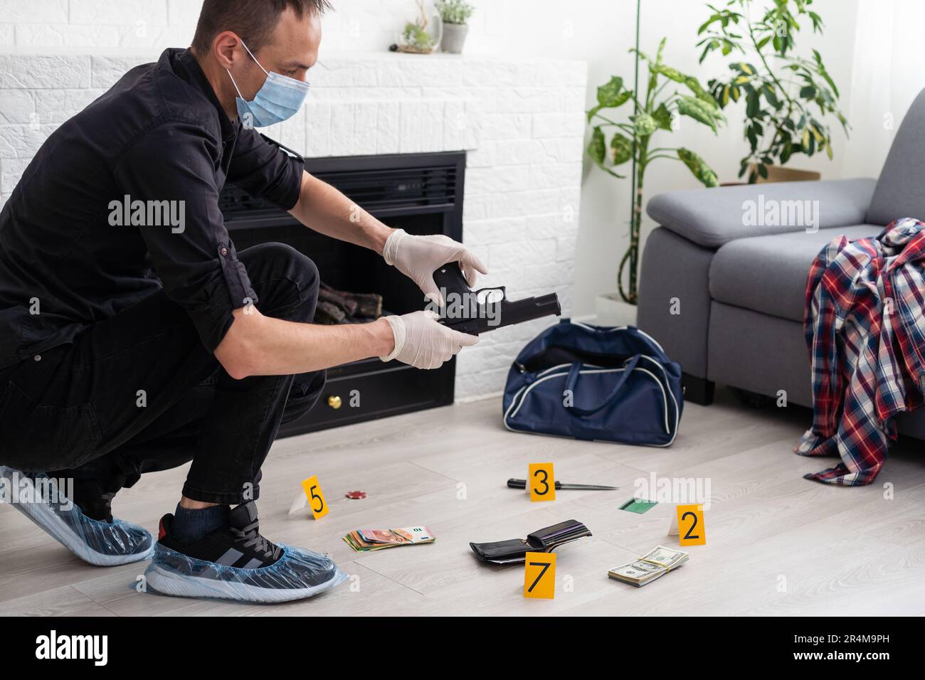 Crime scene investigation - collecting pistol and cartridges by ...