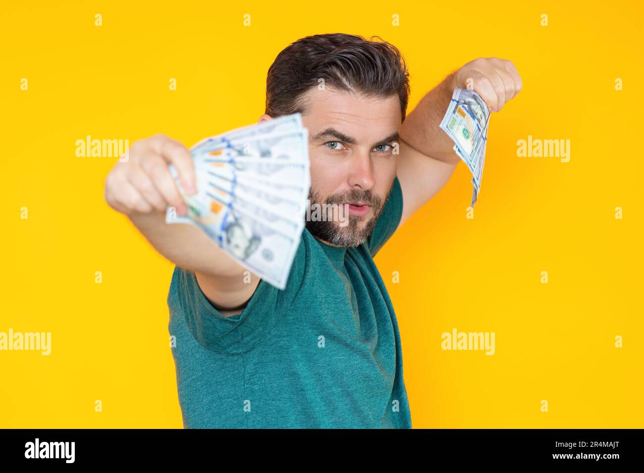 Money cash, dollar banknotes concept. Portrait of man holding bunch of ...