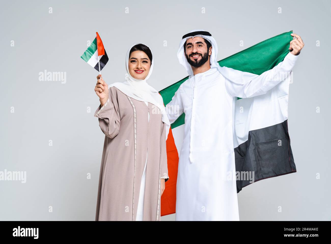 Beautiful arab middle-eastern happy couple of lovers wearing traditional abaya and kandora in ...