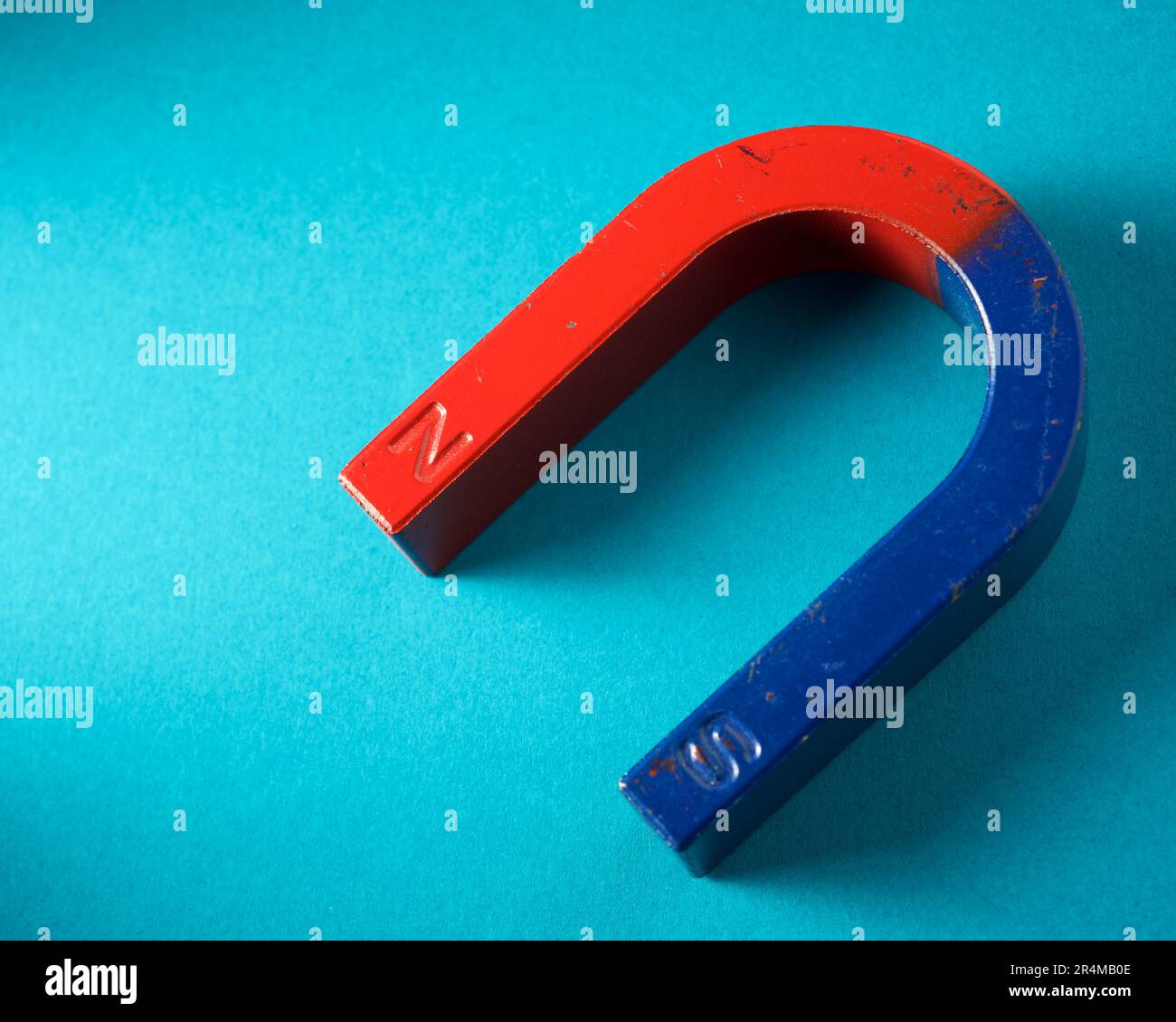 View of a red and blue magnet horseshoe on a green surface Stock Photo ...