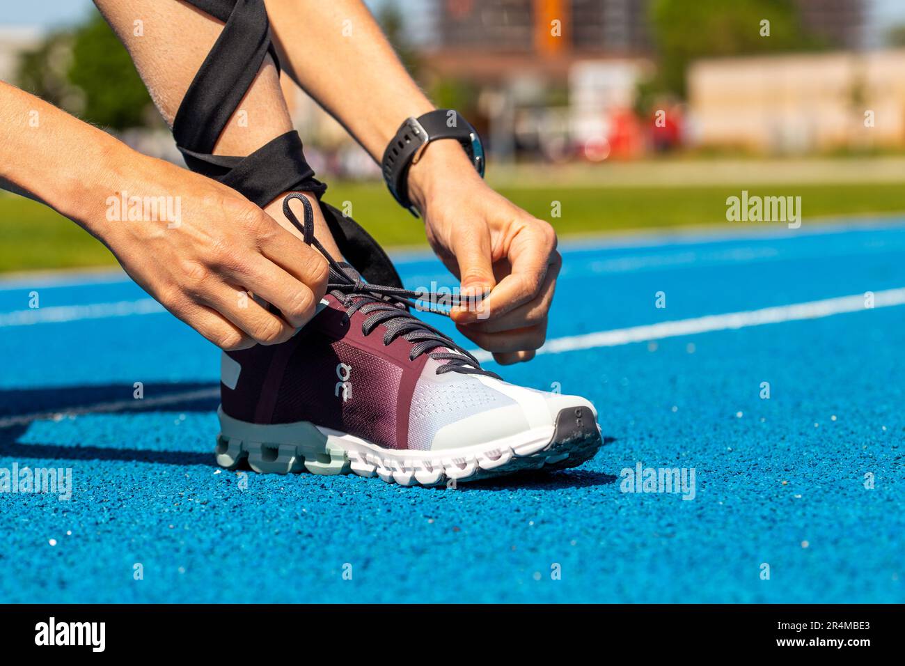 Young female athlete wears running shoes from the Swiss shoe brand ON ...