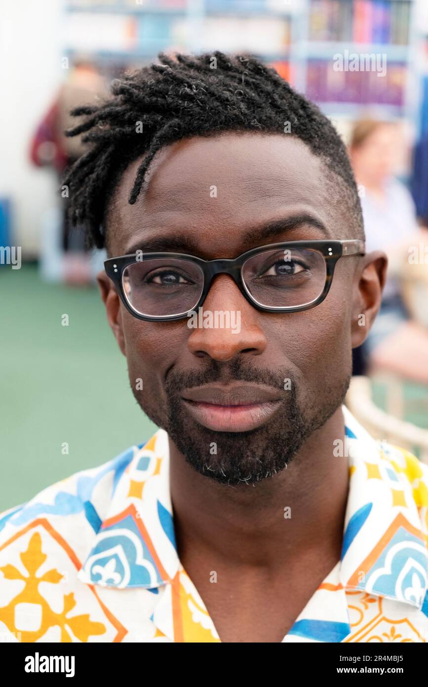 Author writer Jeffrey Boakye signing books in the book shop at the Hay Festival in Hay on Wye ...