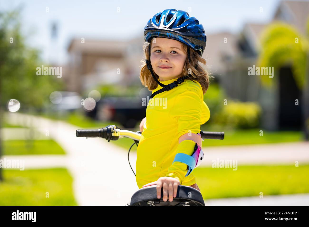 Little kid boy ride a bicycle in the park. Kid cycling on bicycle ...
