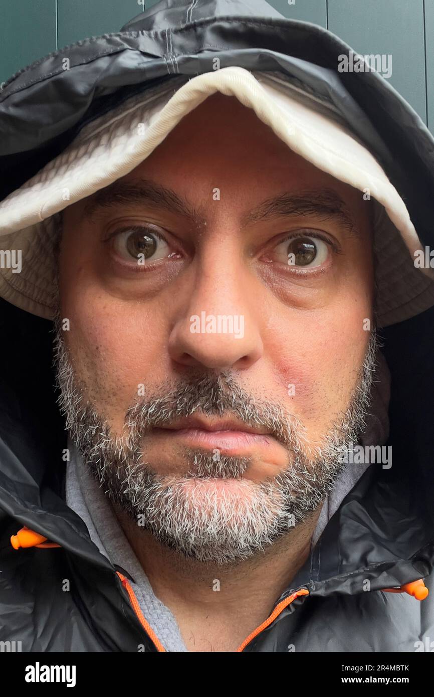 Portrait of angry fisherman Stock Photo - Alamy