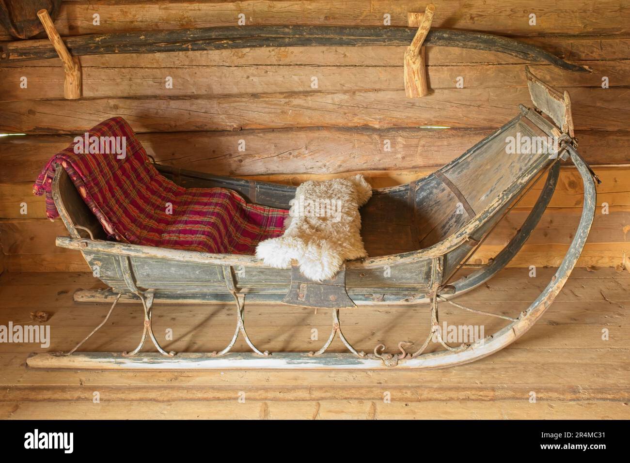 Old wooden snow sleigh inside a wooden barn Stock Photo - Alamy