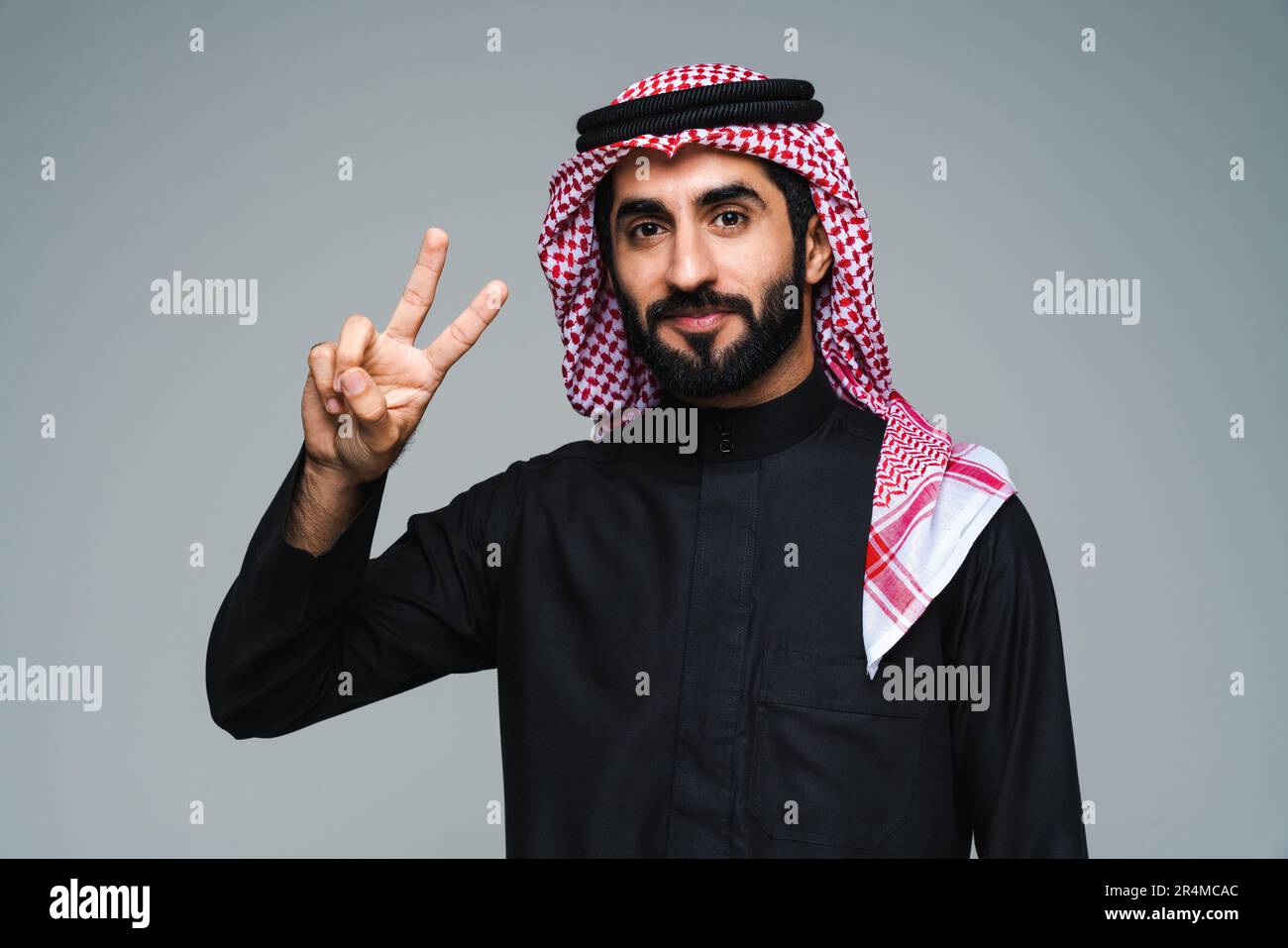 Handsome arab middle-eastern saudi arabian man with traditional saudi ...