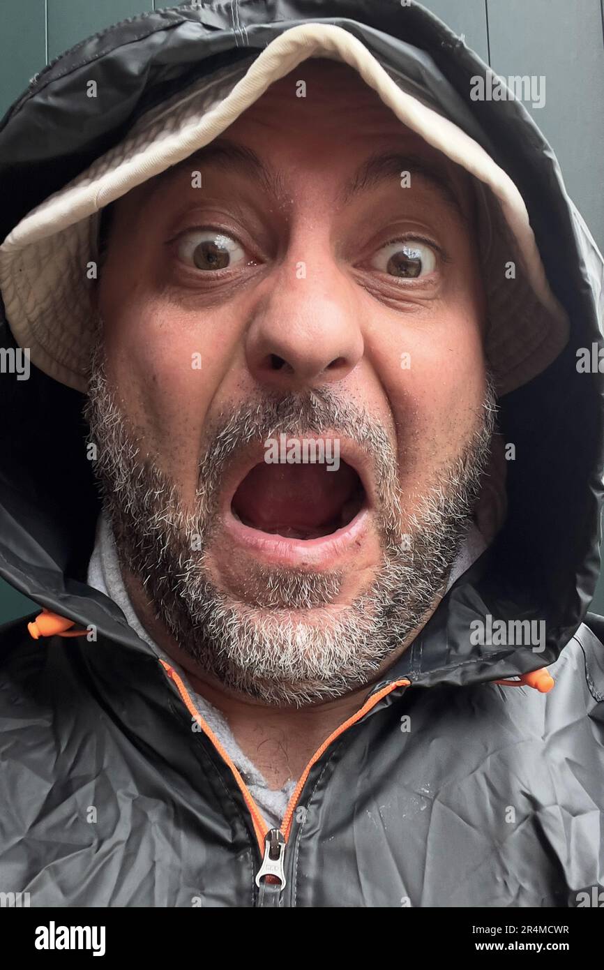 Portrait of angry fisherman Stock Photo - Alamy