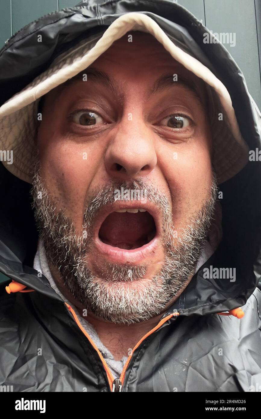 Portrait of angry fisherman Stock Photo - Alamy