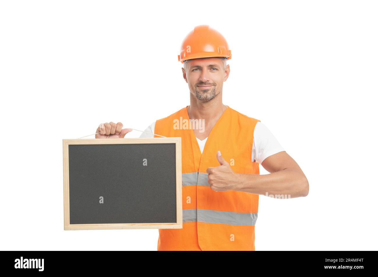 builder show advertisement on background, thumb up. photo of builder ...