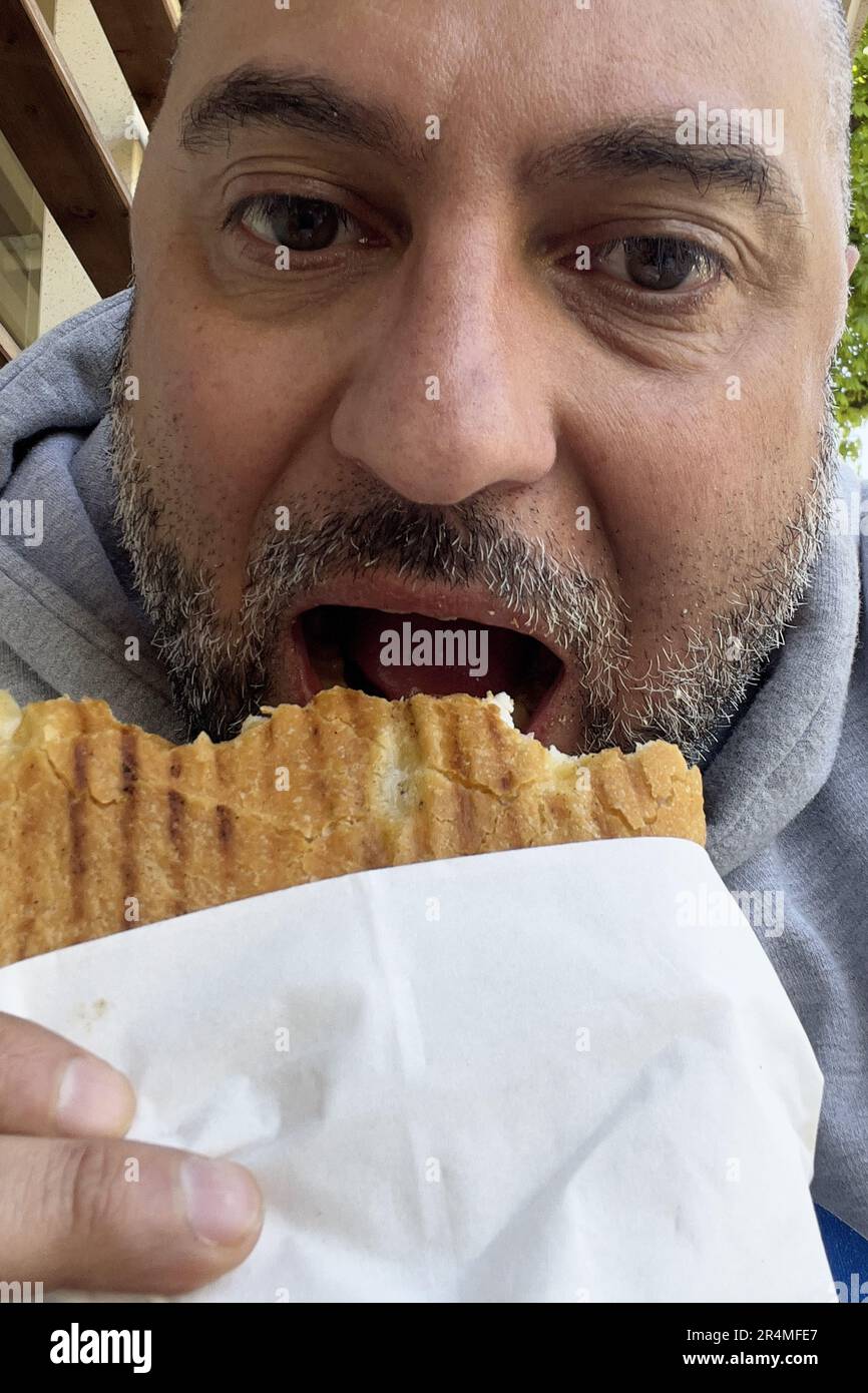 Man gorging food hi-res stock photography and images - Alamy
