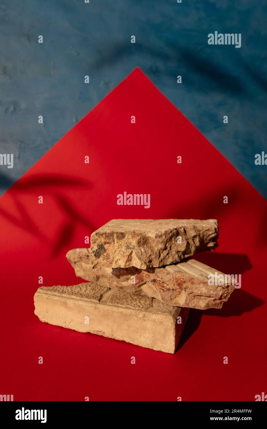 Rock platform product display stone stack red blue Stock Photo - Alamy