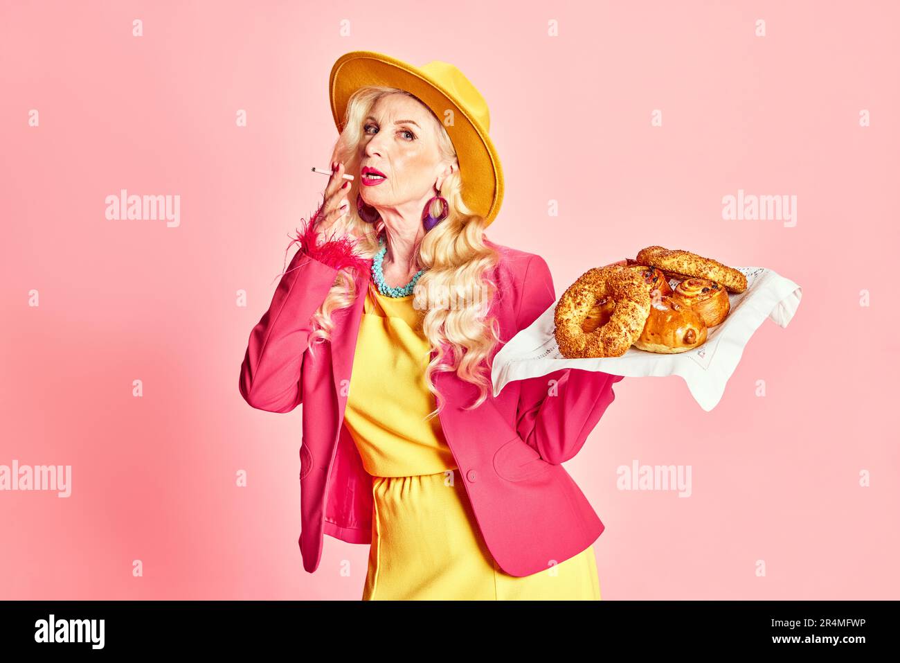 Portrait of stylish, beautiful, senior woman in colorful clothes ...