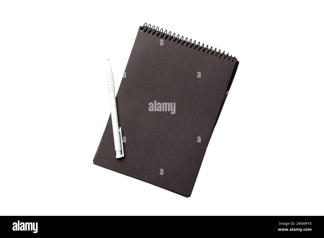 Top view of closed spiral blank dark paper cover notebook with pencil ...
