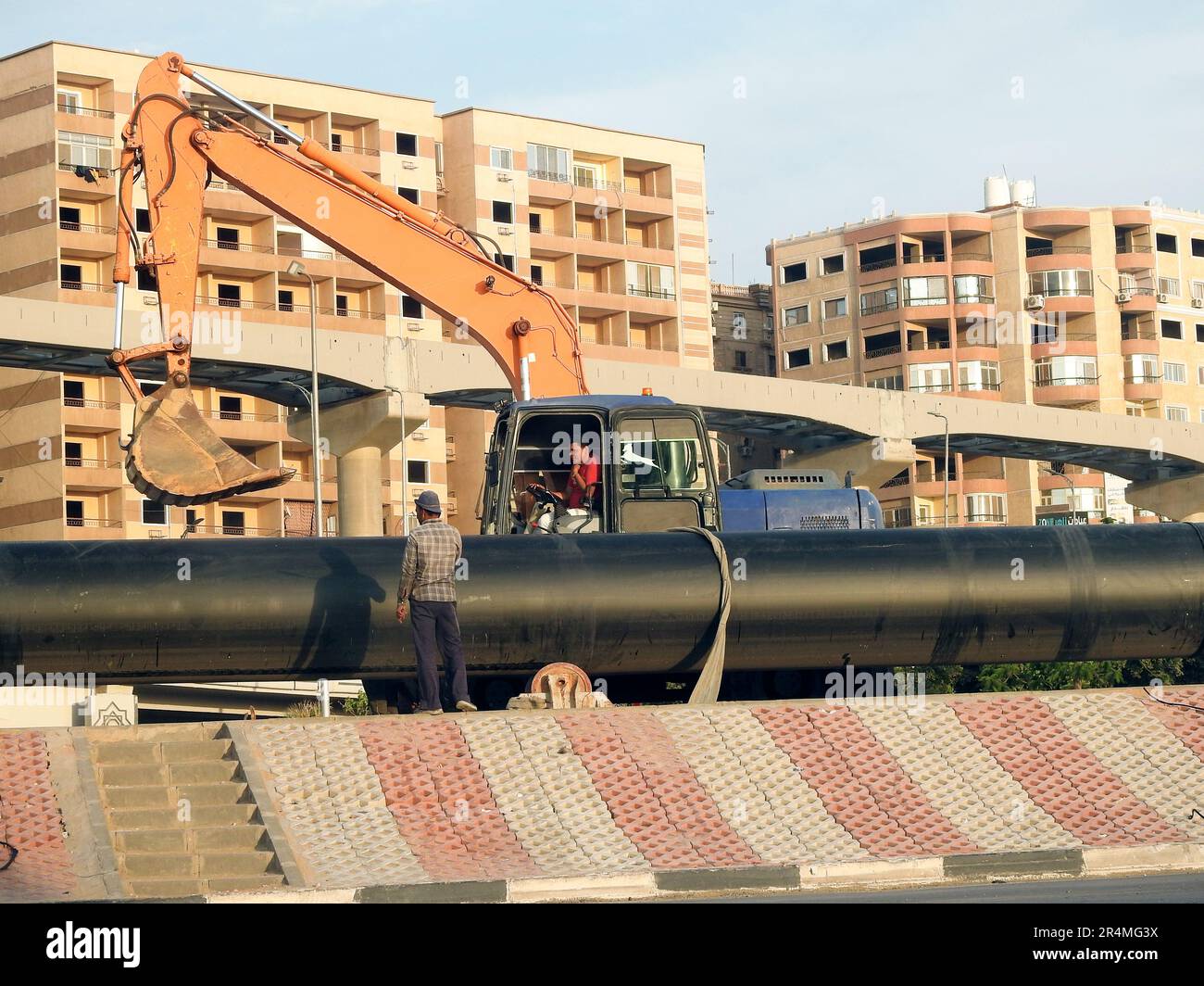 Cairo, Egypt, May 18 2023: preparations to place large water pipe parts ...