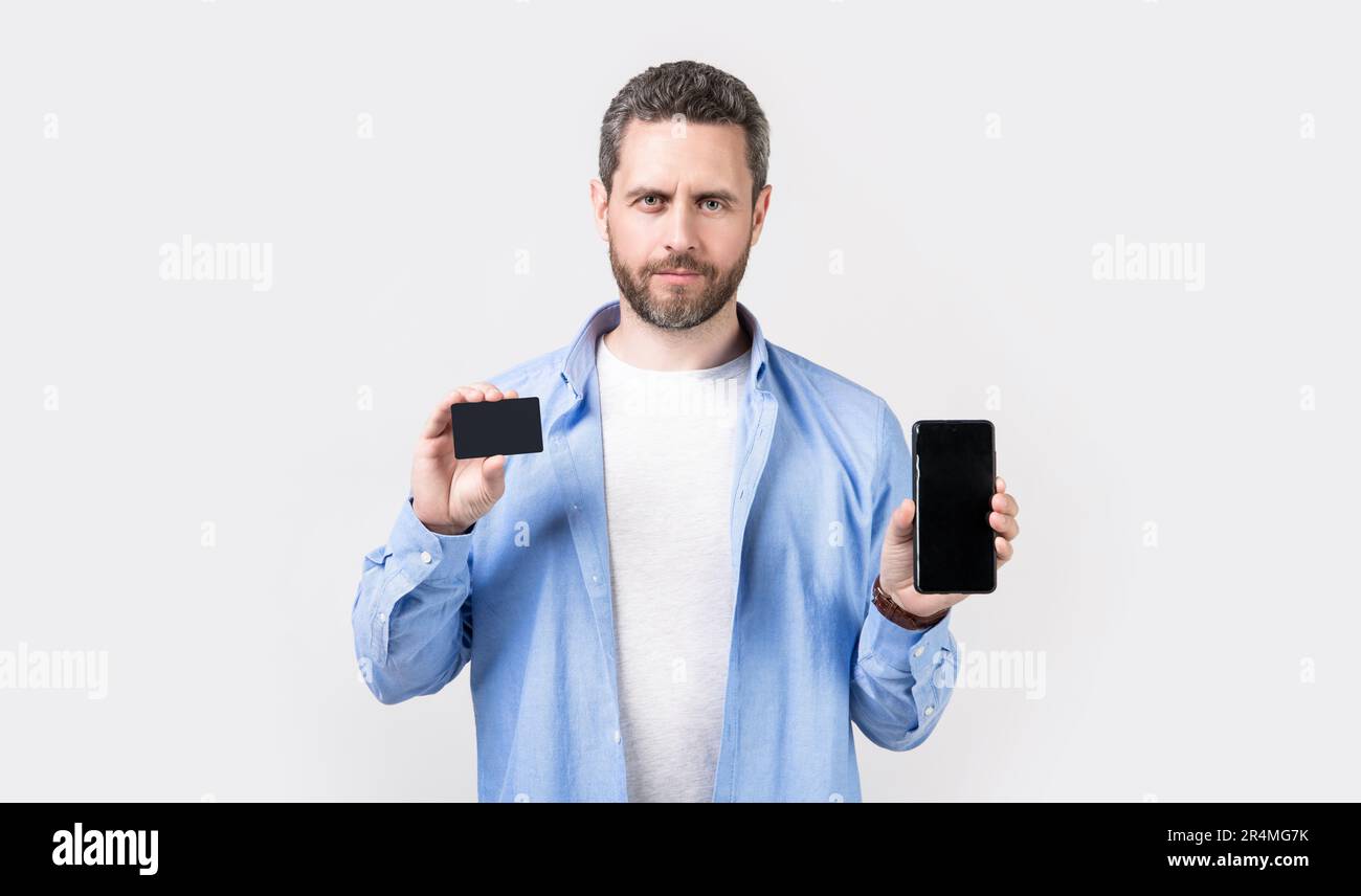man paying transaction isolated on studio background. man paying ...