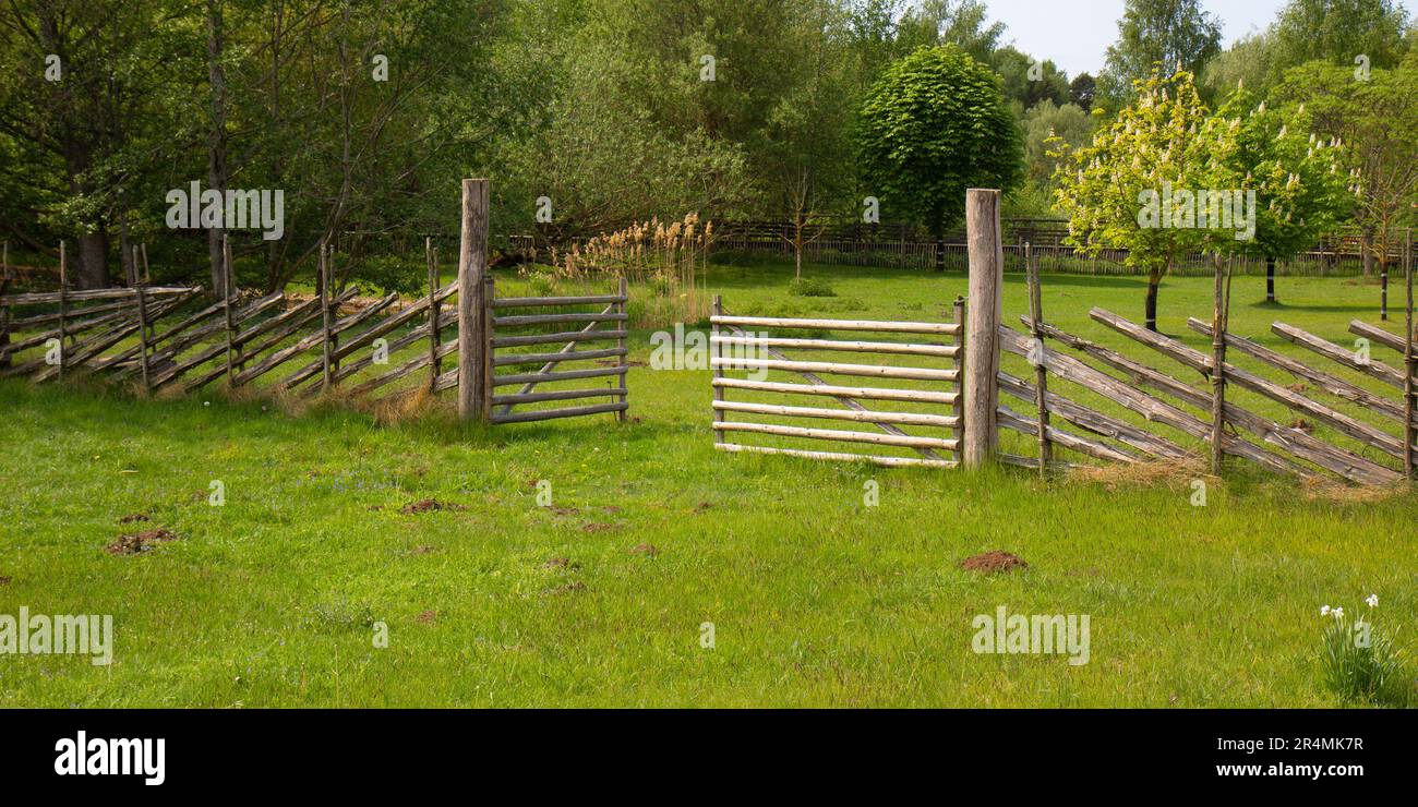 Save Download Preview Rural view of a traditional wooden gate set in ...