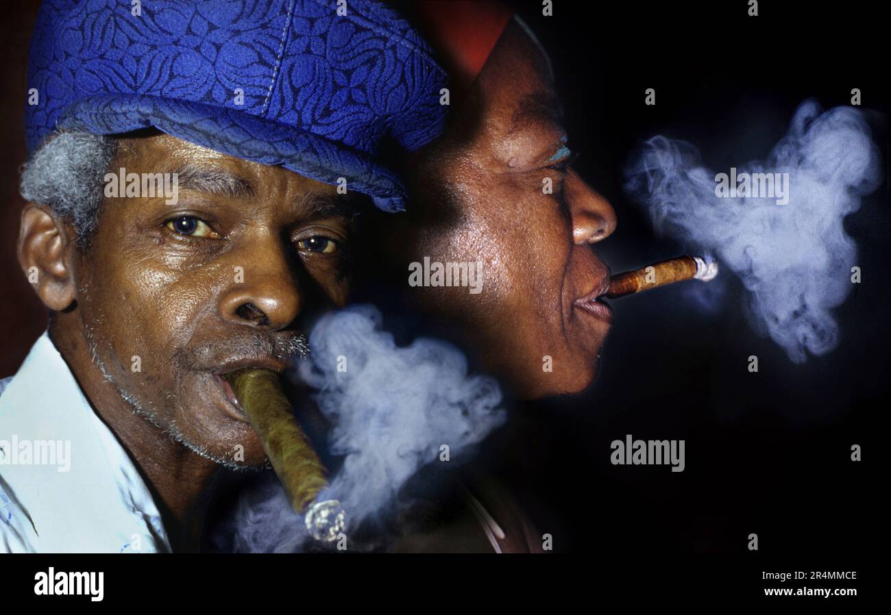 Cuban woman smoking cigar Stock Photo - Alamy