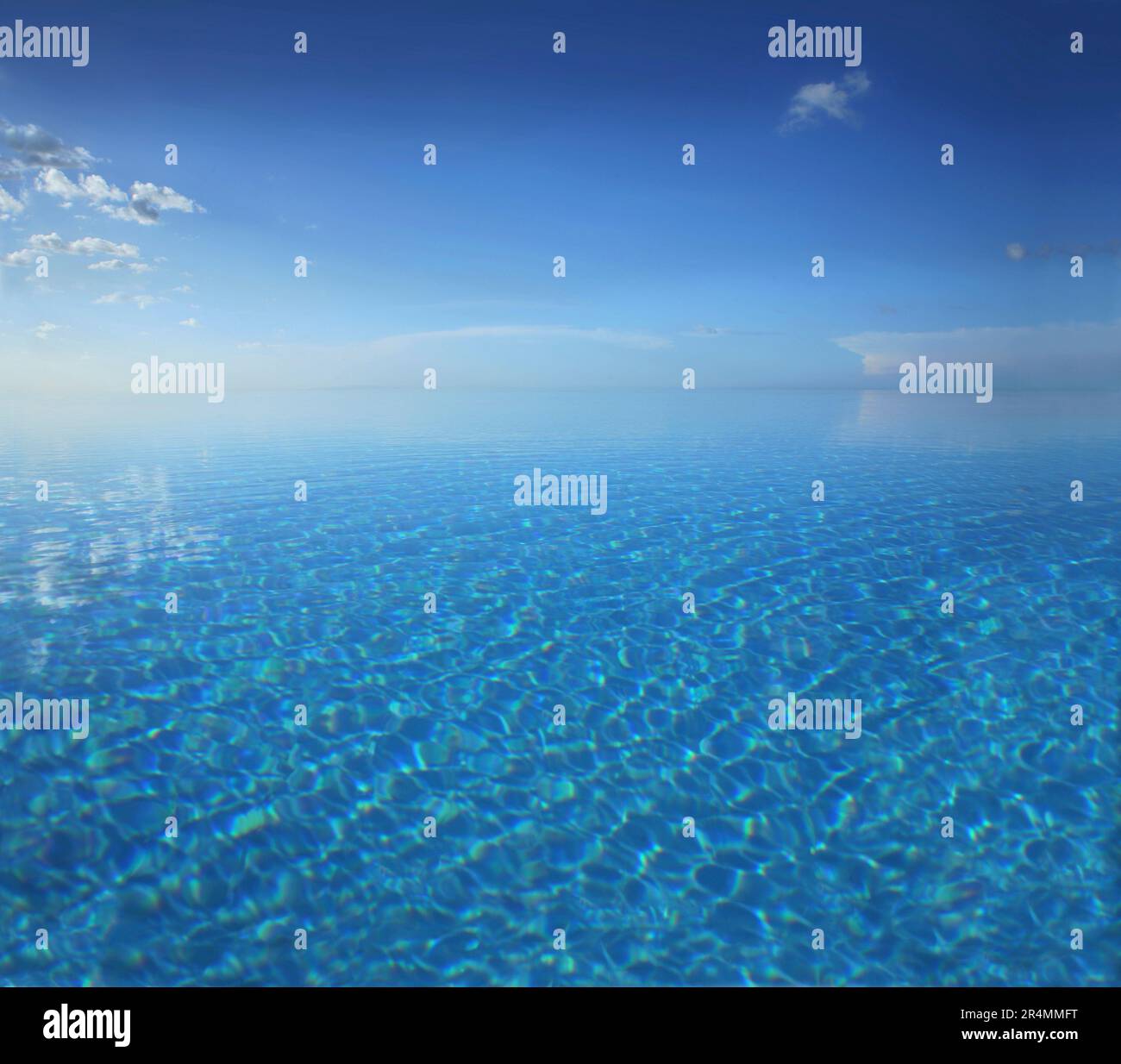 Infinity pool beneath a clear blue sky at a hotel resort in the ...