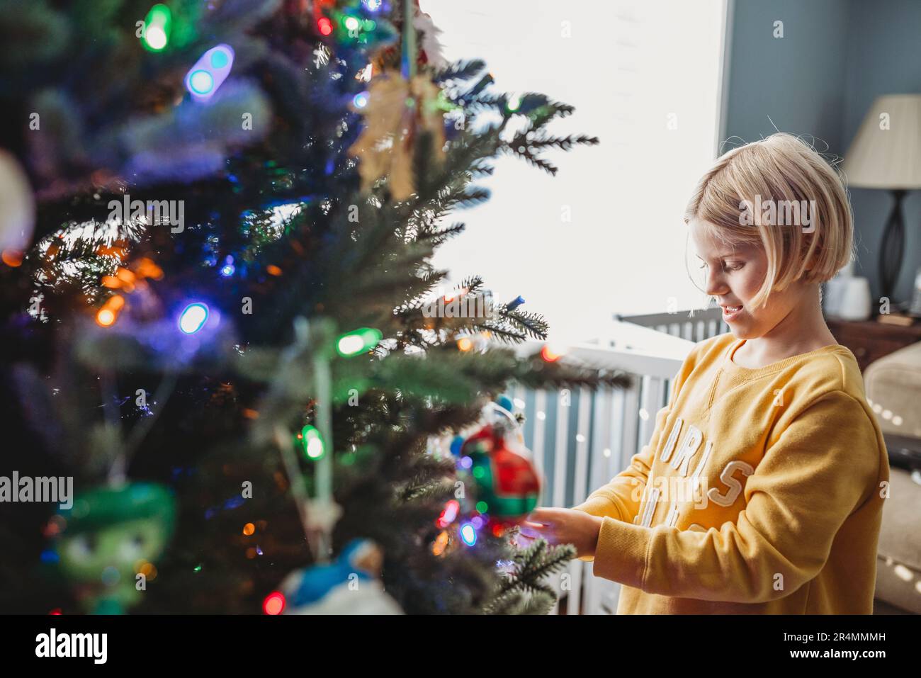 Little blonde girl christmas tree hi-res stock photography and images ...